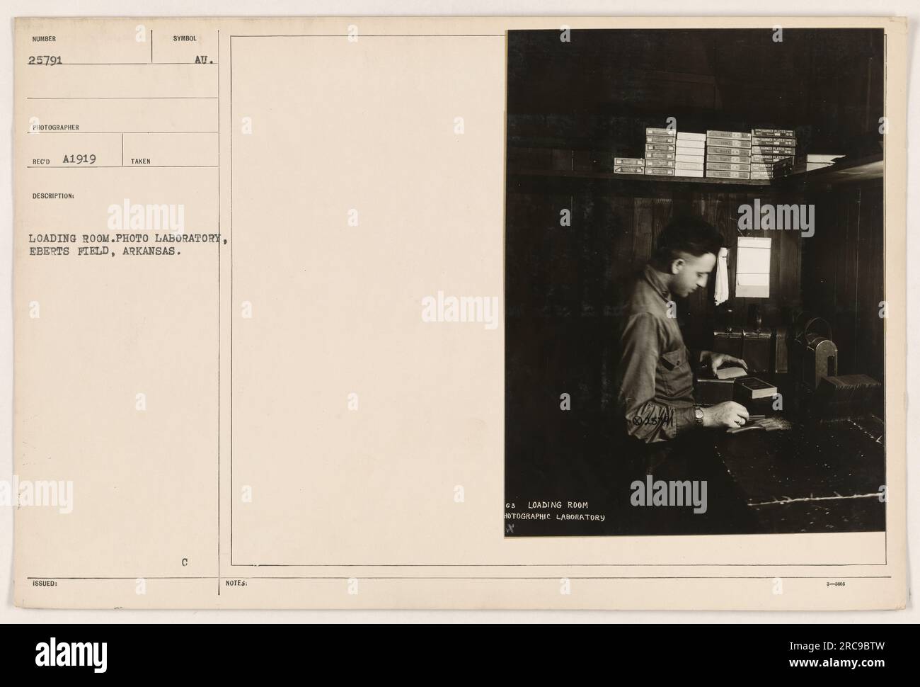 American military personnel loading equipment in a photographic ...