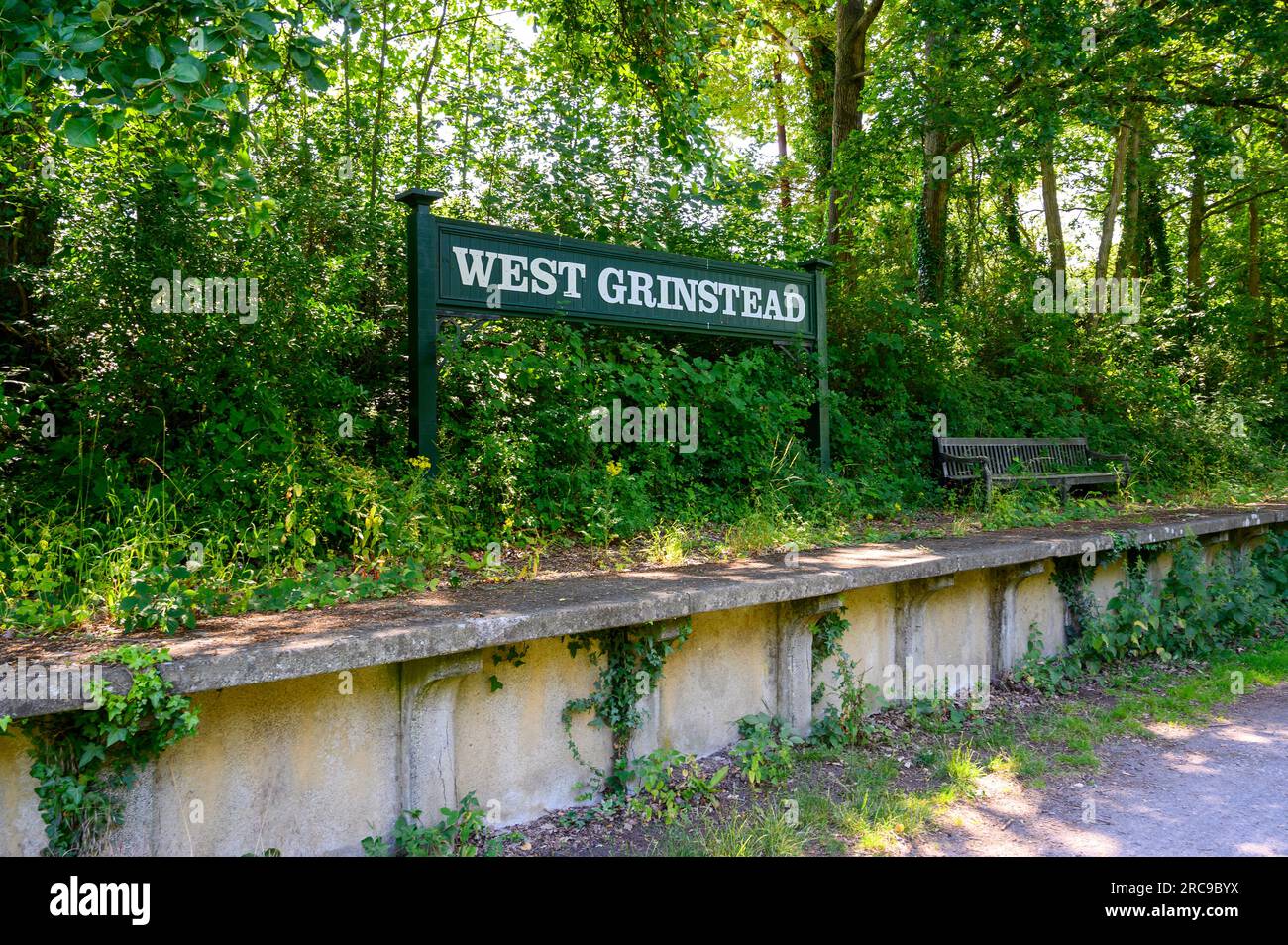 The old and defunct West Grinstead train station platform and sign on ...