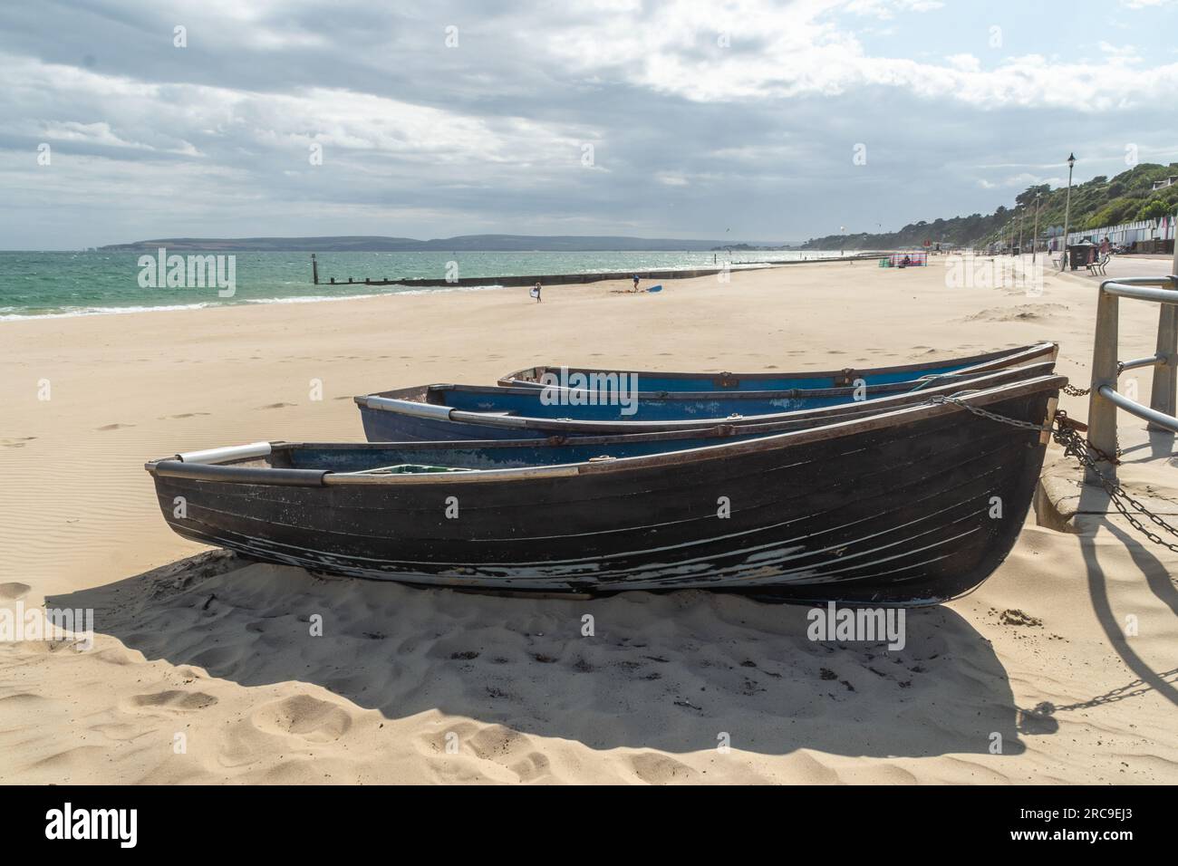 Middle Chine, Bournemouth, UK - July 12th 2023: Three rowboats on the ...