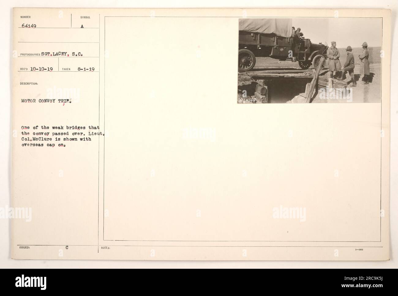 Lieutenant Colonel McClure is seen wearing an overseas cap while the ...