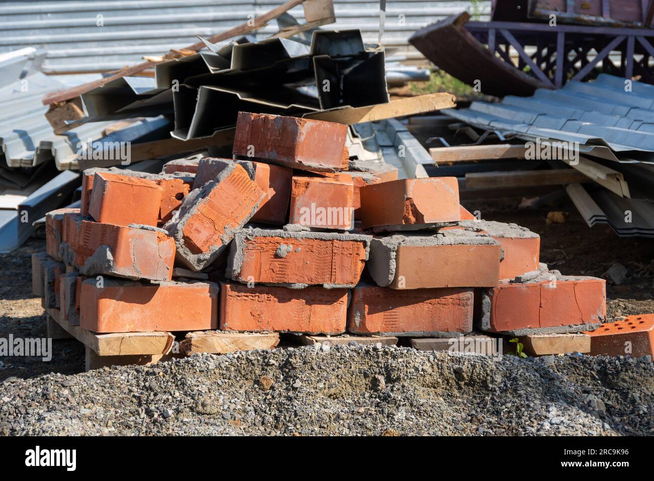 A pile of old red bricks with the remains of dried mortar. Building ...