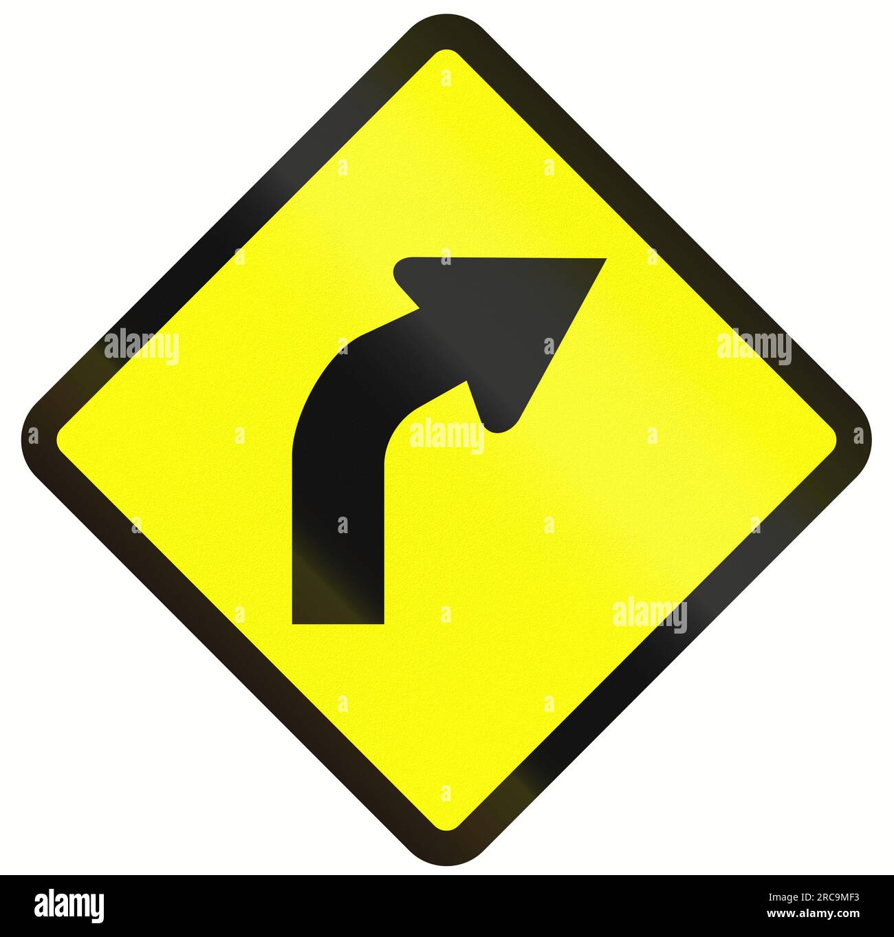 Indonesian road warning sign: Right curve ahead Stock Photo - Alamy