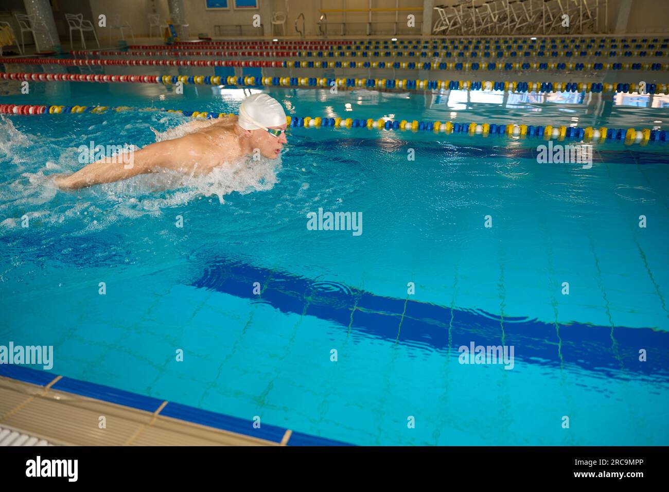 Man swimming in butterfly style in the pool Stock Photo - Alamy