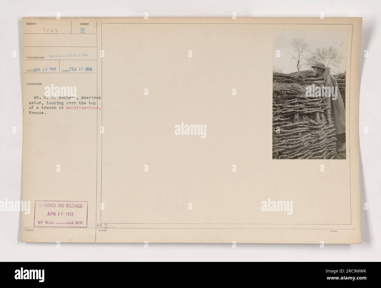 Mr. EH Sothern, an American actor, peers over the top of a trench in ...