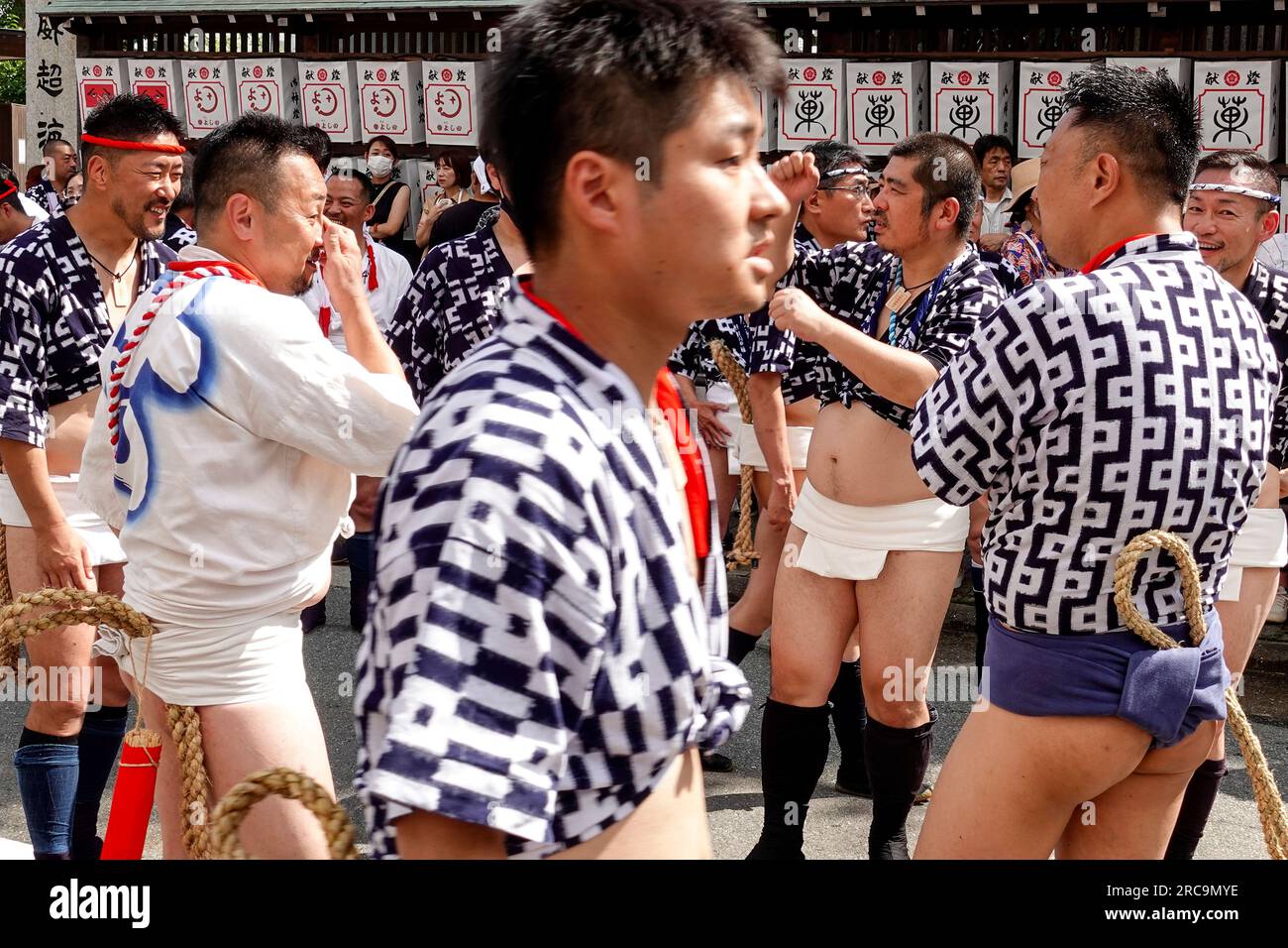 Men in traditional costume prepare for the Hakata Gion Yamakasa, one of ... Men in traditional costume prepare for the Hakata Gion Yamakasa, one of ...