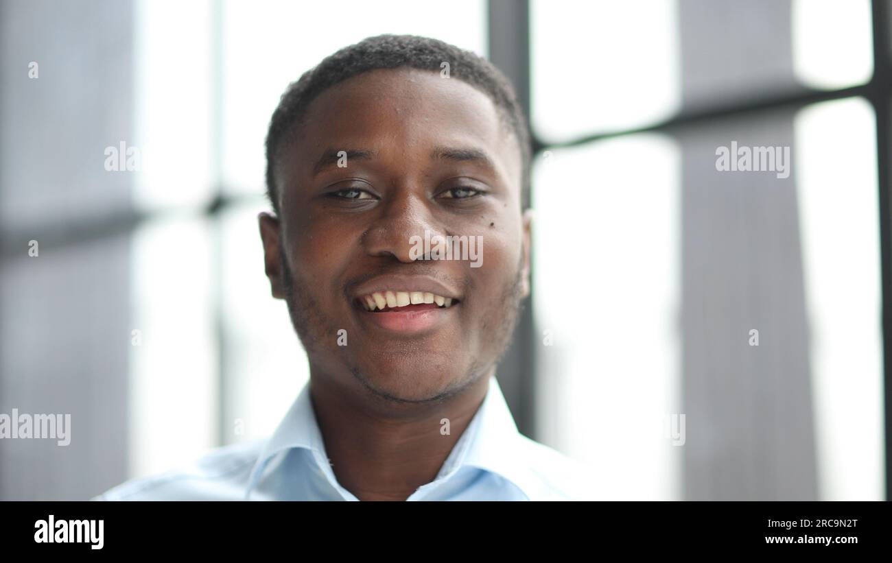 Portrait of successful young African American journalist with deep-in ...