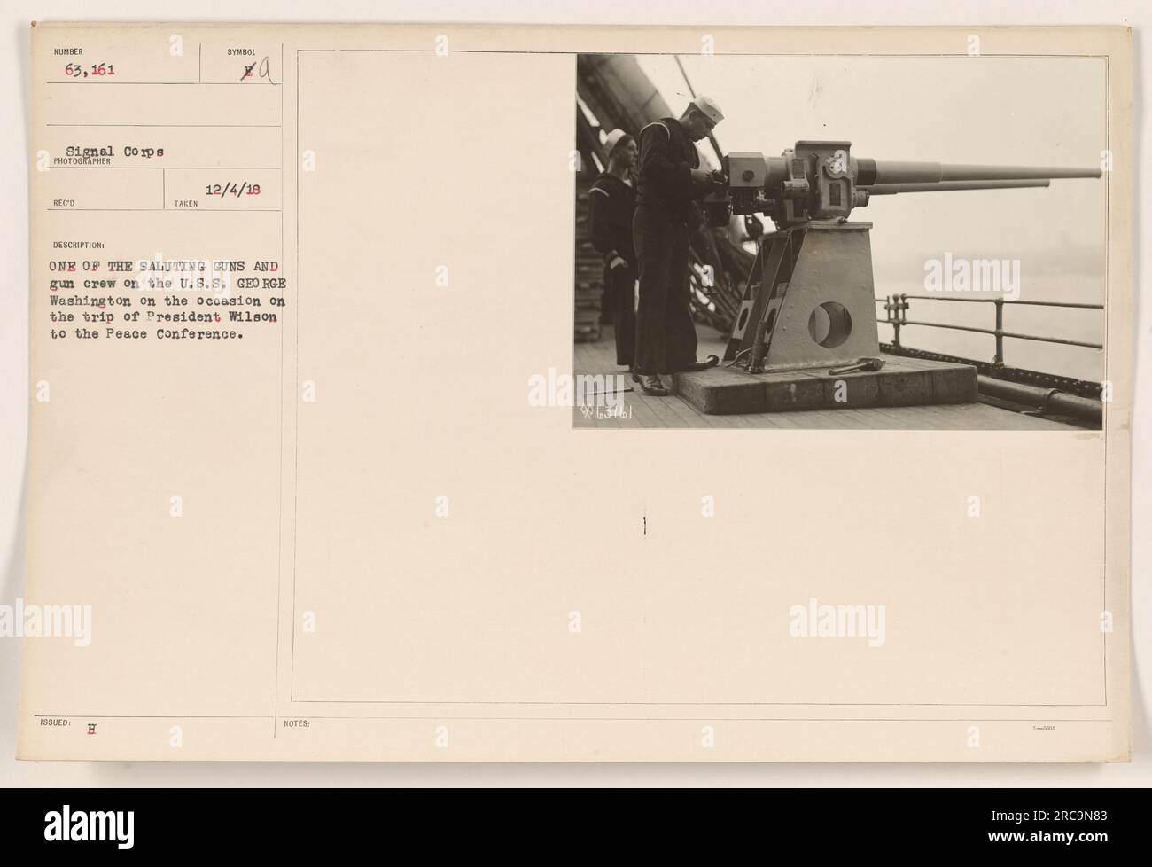 This photograph captures a saluting gun and its crew on the U.S.S ...