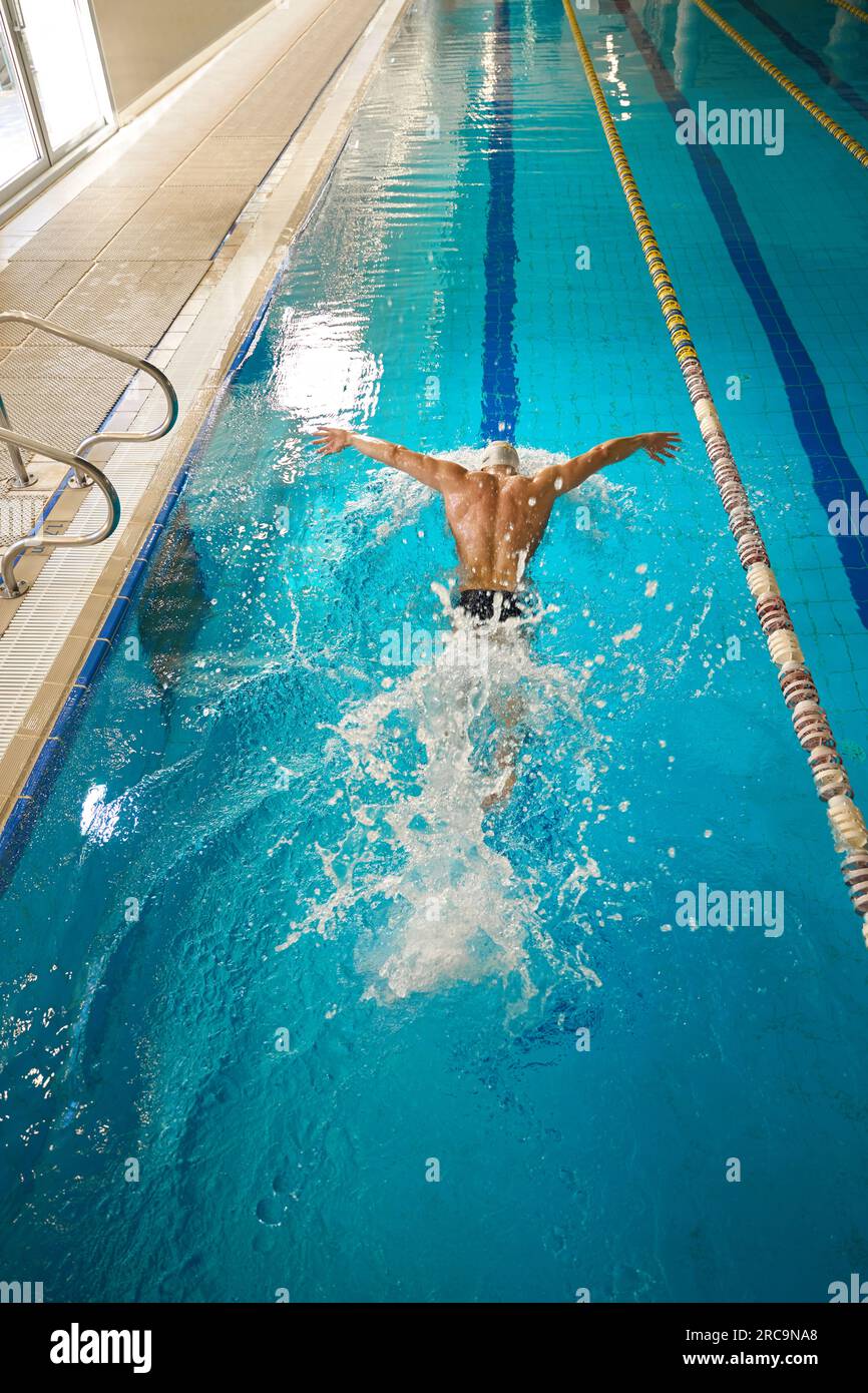 Man doing workout for recovery in the pool Stock Photo - Alamy
