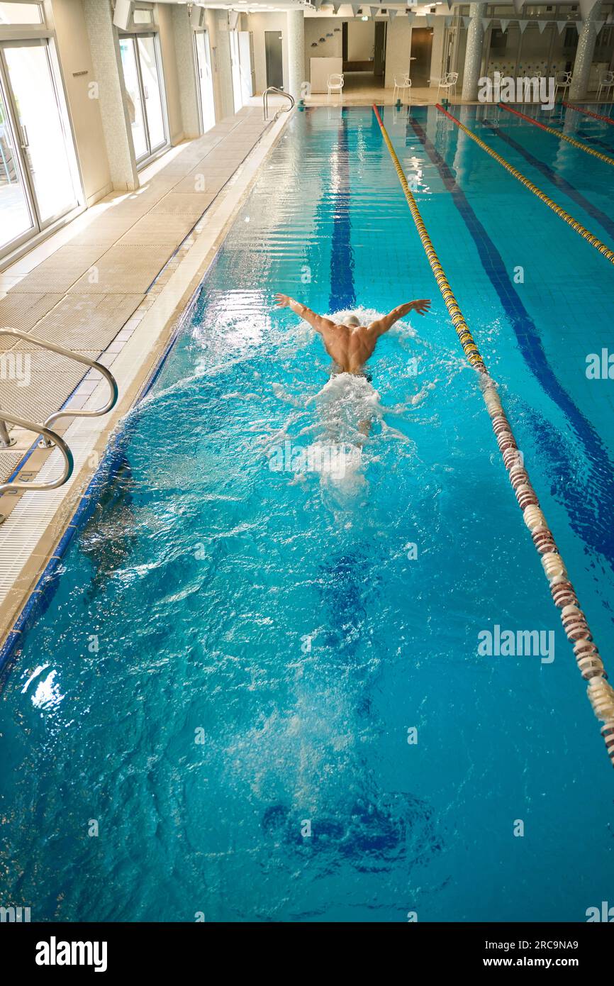 Male doing workout for recovery in the pool Stock Photo - Alamy
