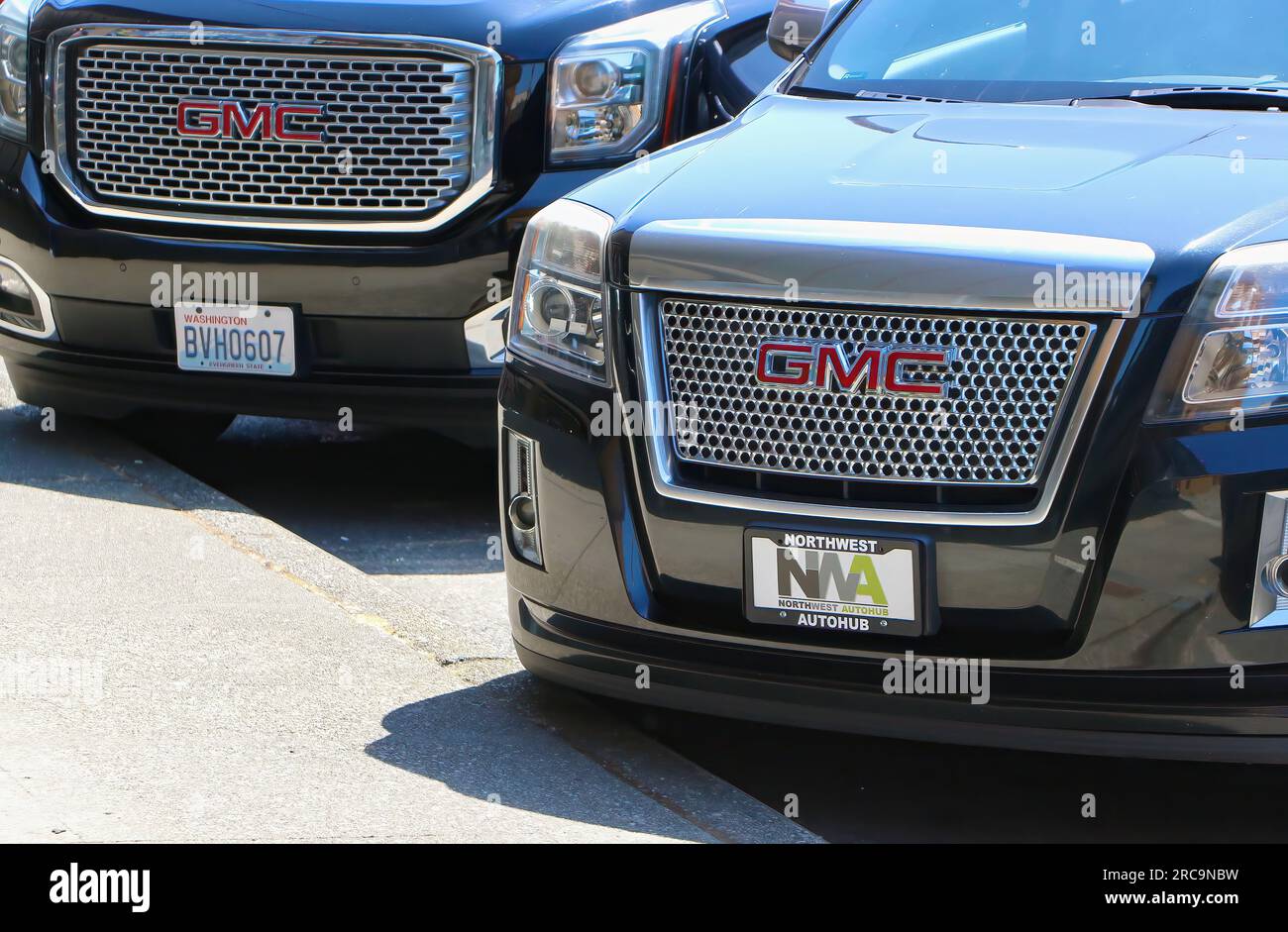 Photo of front grills of GMC Yukon XL Denali and GMC Terrain Denali SUV ...