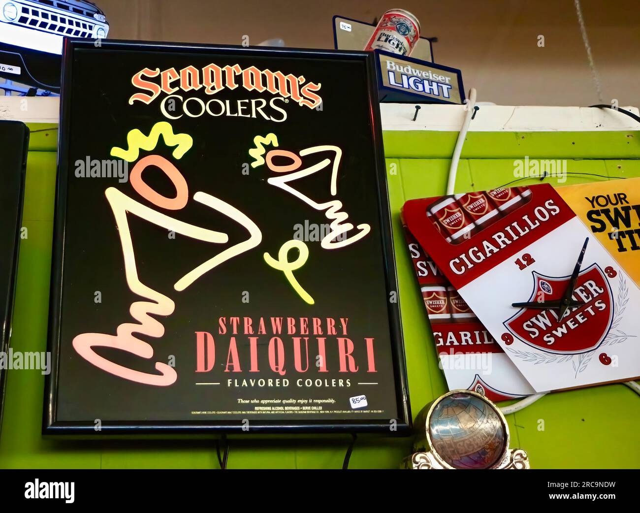 Photo of a Seagram's Coolers Strawberry Daiquiri sign and a clock ...