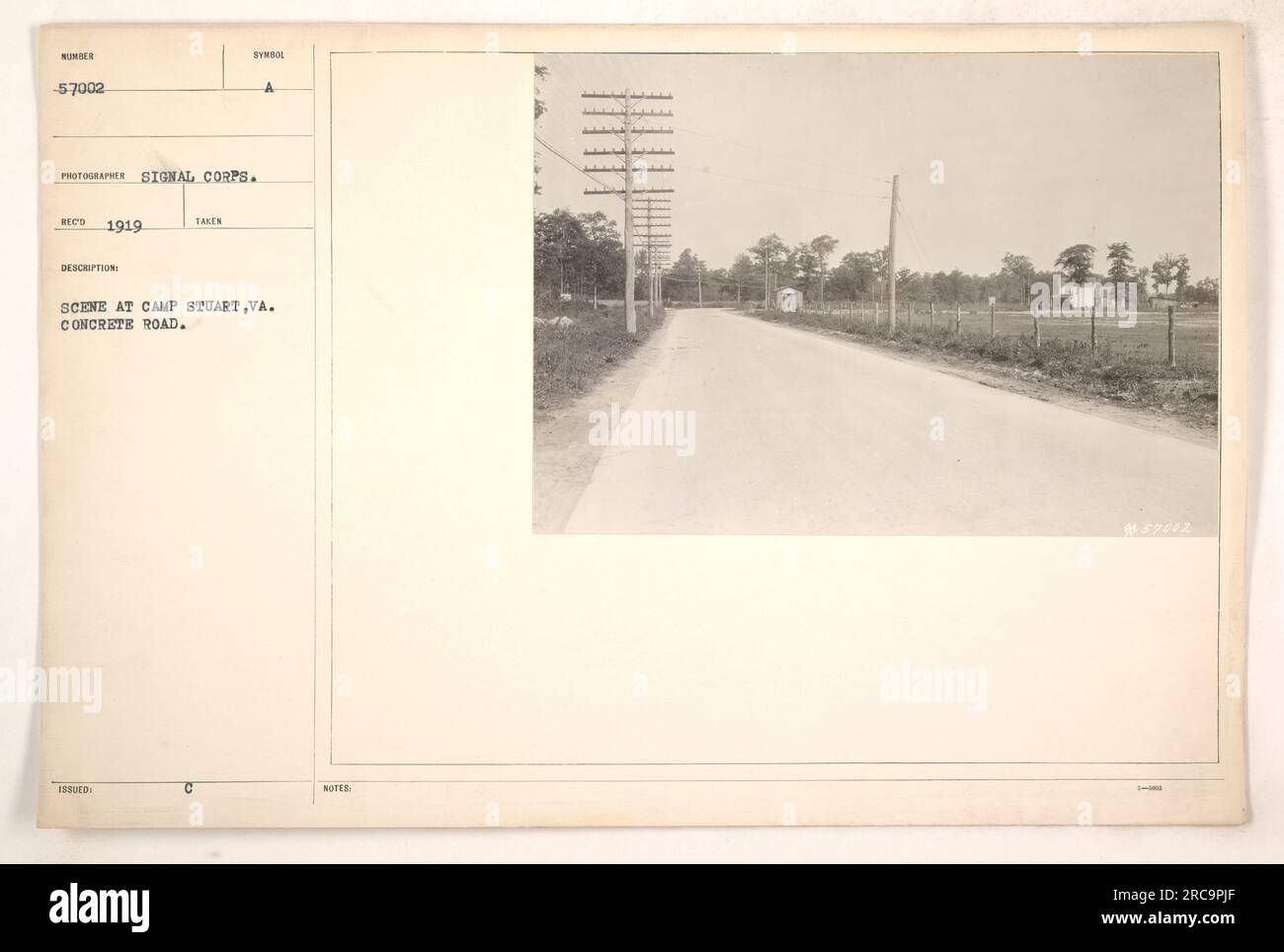 Soldiers at Camp Stuart, Virginia, walking along a concrete road. This ...