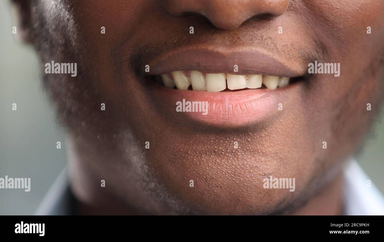 Close-up of the male lips of a black man Stock Photo - Alamy