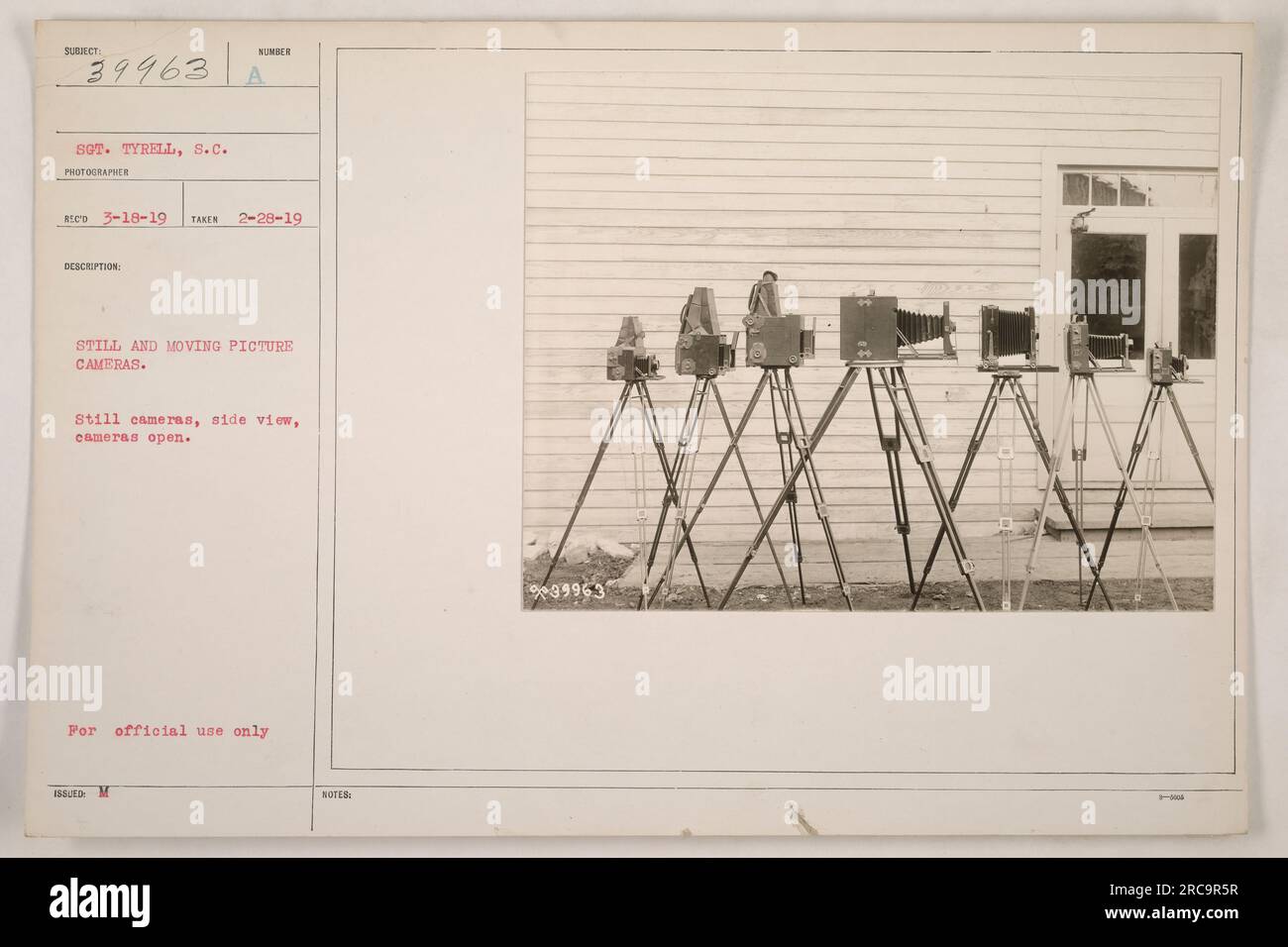 Sergeant Tyrell, a photographer, is seen with a still and moving ...