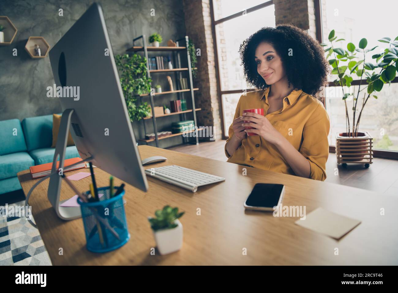 Photo of successful charming recruiter girl sit chair hands hold tea ...