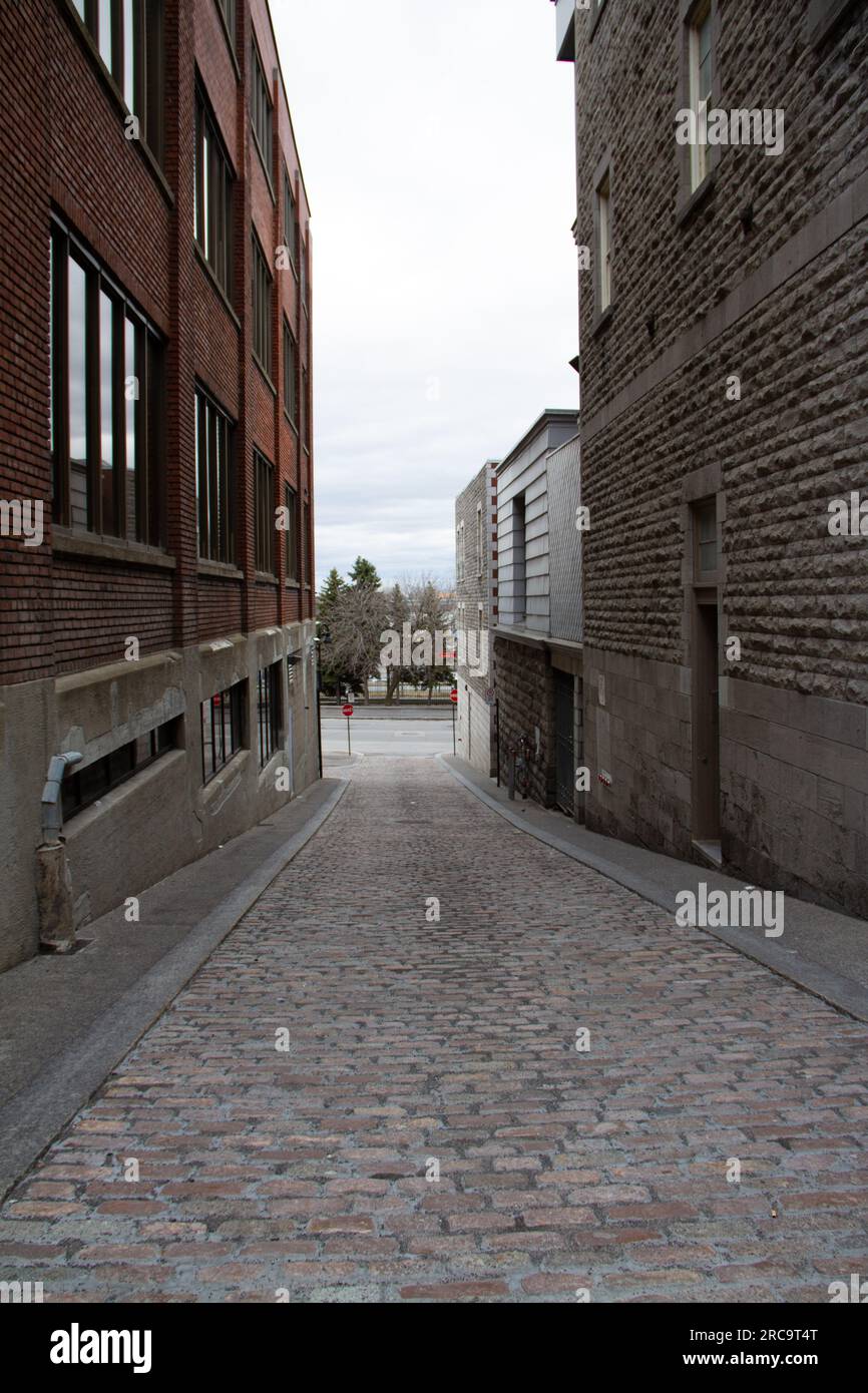 Back alley street in Old Montreal, Montreal, Quebec Provence, Canada ...