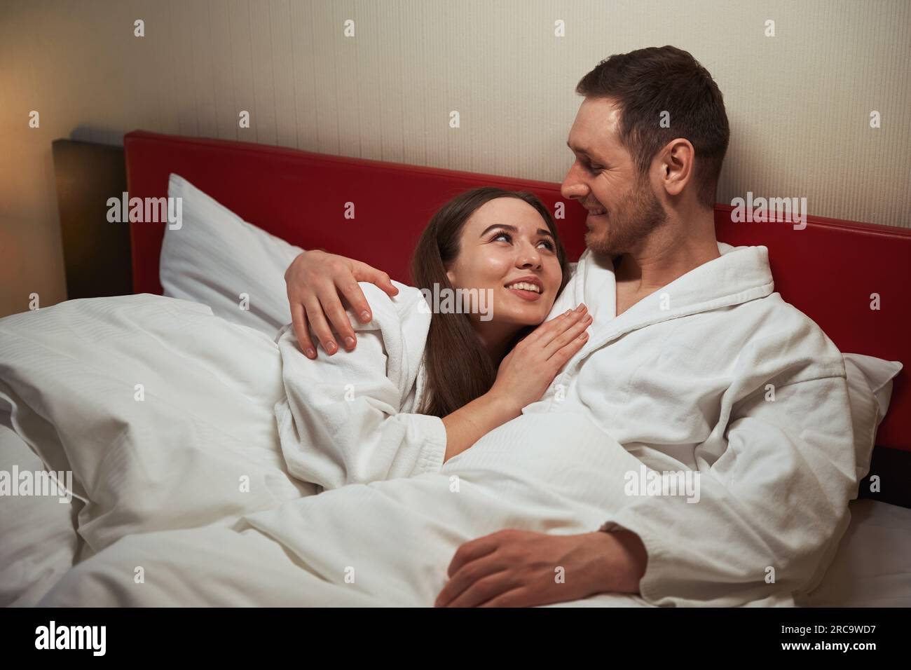 Romantic couple resting in their hotel room Stock Photo - Alamy
