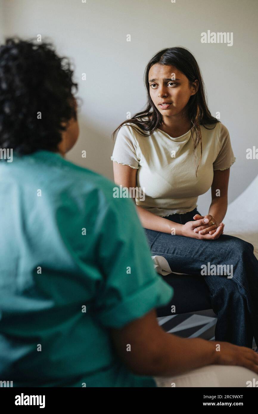 Woman in clinic talking on hi-res stock photography and images - Alamy