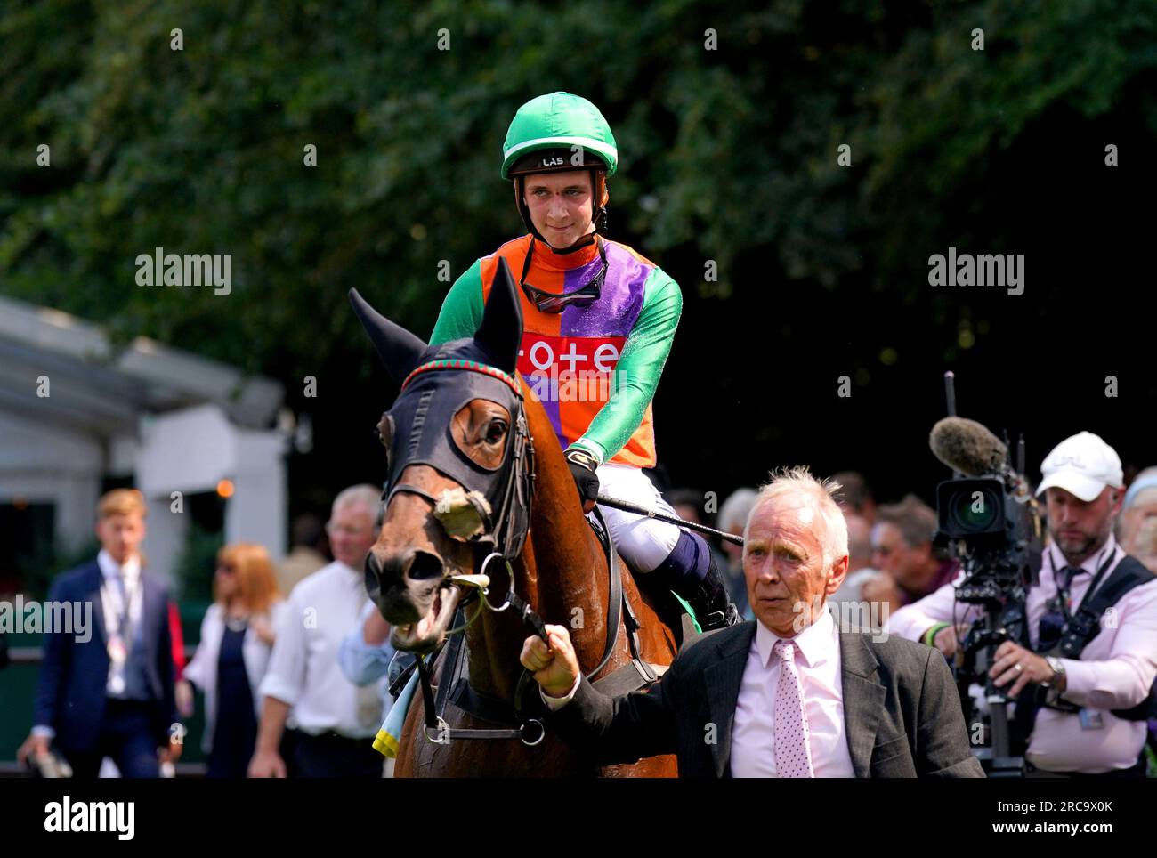 Quinault ridden by jockey Connor Planas is led into the winners ...