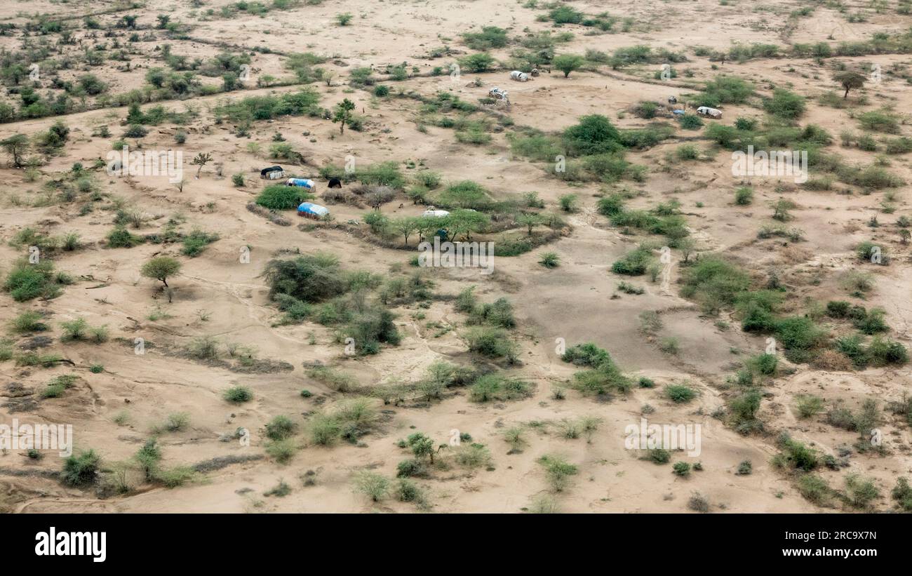 Aerial view of the dry sahel with desert livestock herders in Ethiopia ...