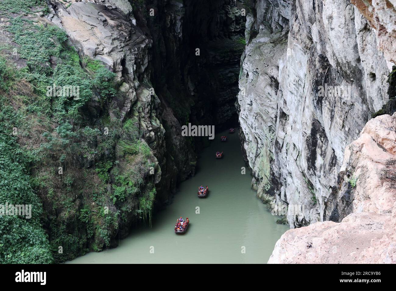 CHONGQING, CHINA - JULY 13, 2023 - Tourists take a boat to cross the ...
