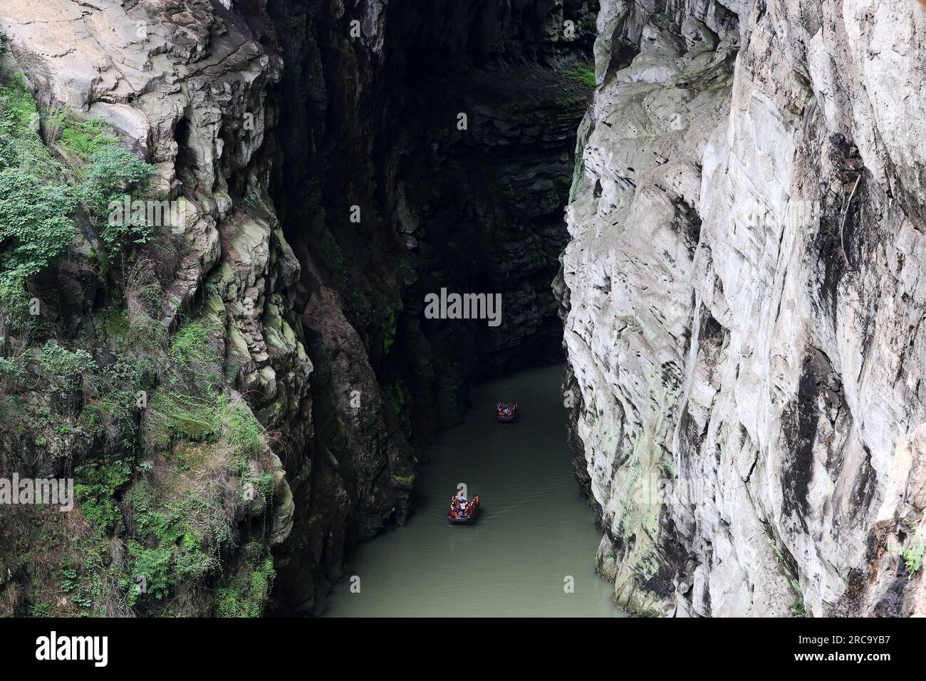 CHONGQING, CHINA - JULY 13, 2023 - Tourists take a boat to cross the ...