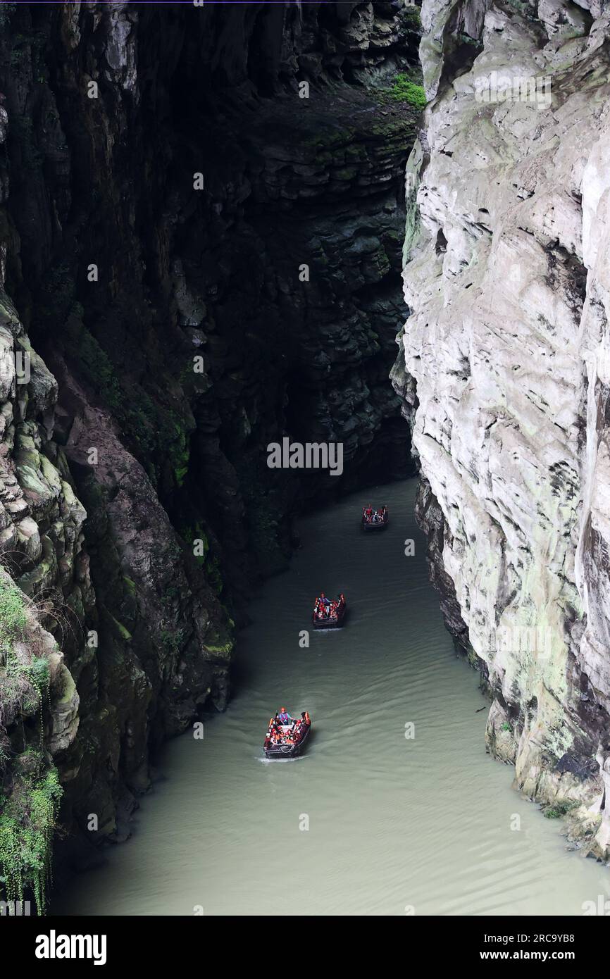CHONGQING, CHINA - JULY 13, 2023 - Tourists take a boat to cross the ...