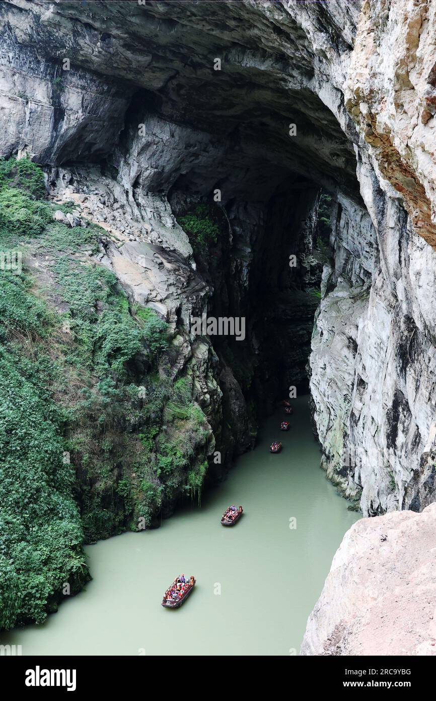CHONGQING, CHINA - JULY 13, 2023 - Tourists take a boat to cross the ...