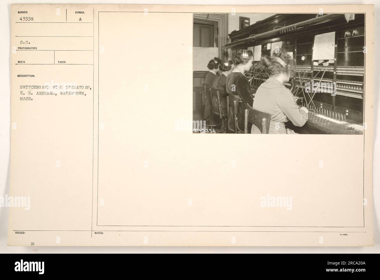 A group of operators seen working diligently at a switchboard in the U ...