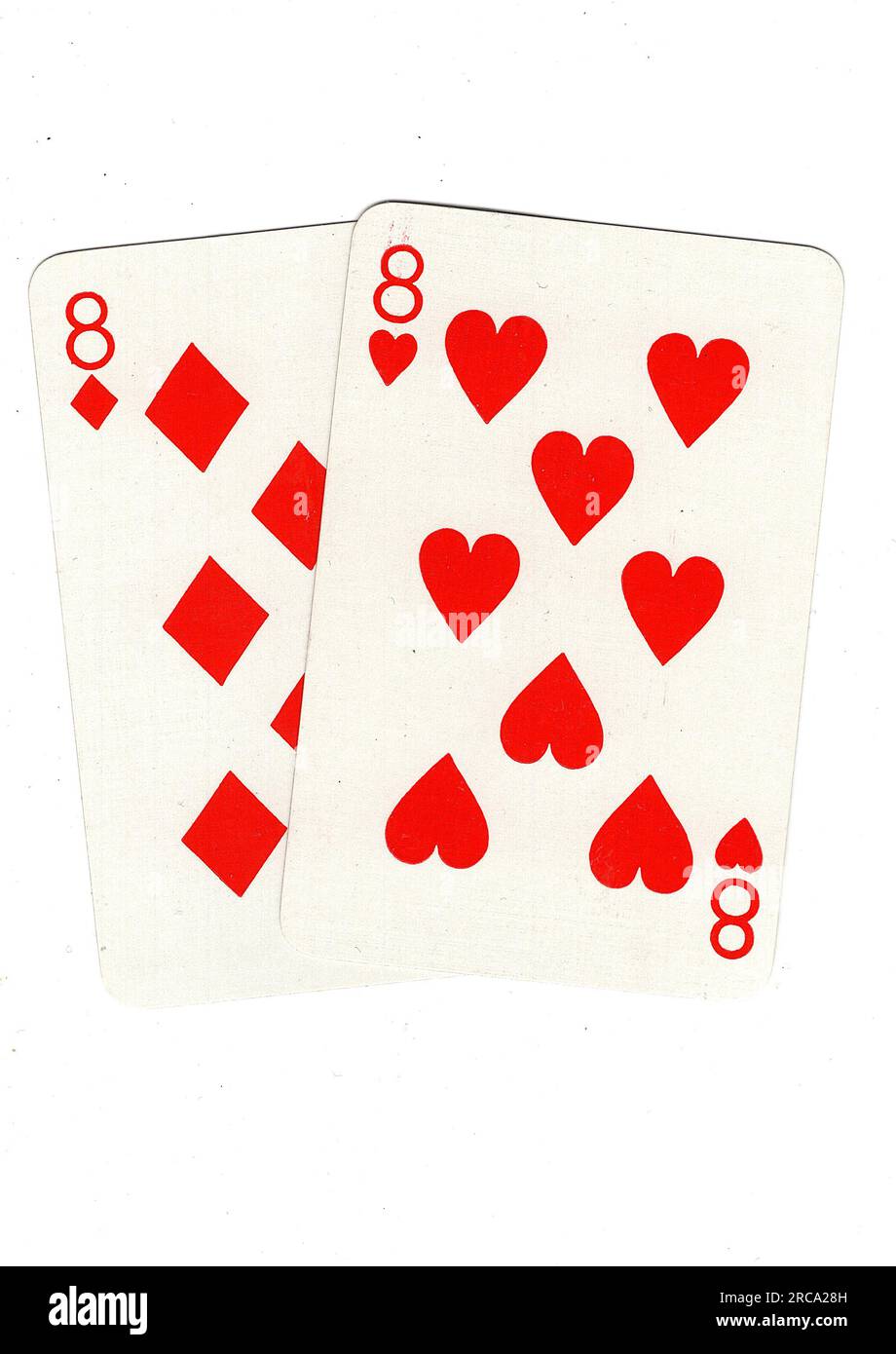 Vintage playing cards showing a pair of red eights on a white ...