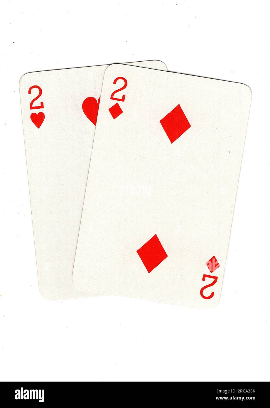 Vintage playing cards showing a pair of red twos on a white background ...