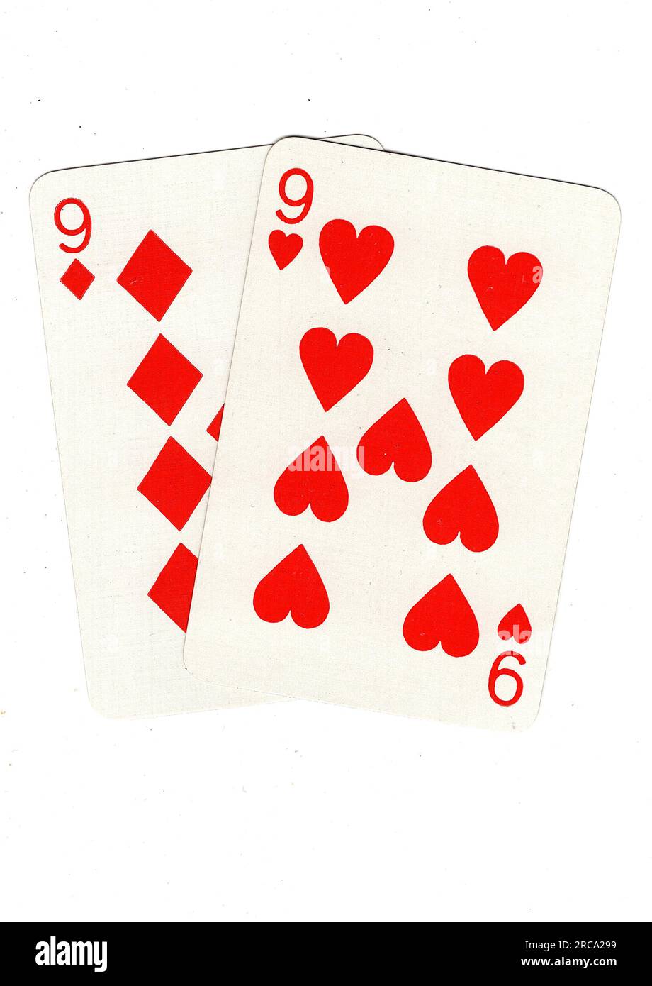 Vintage playing cards showing a pair of red nines on a white background ...