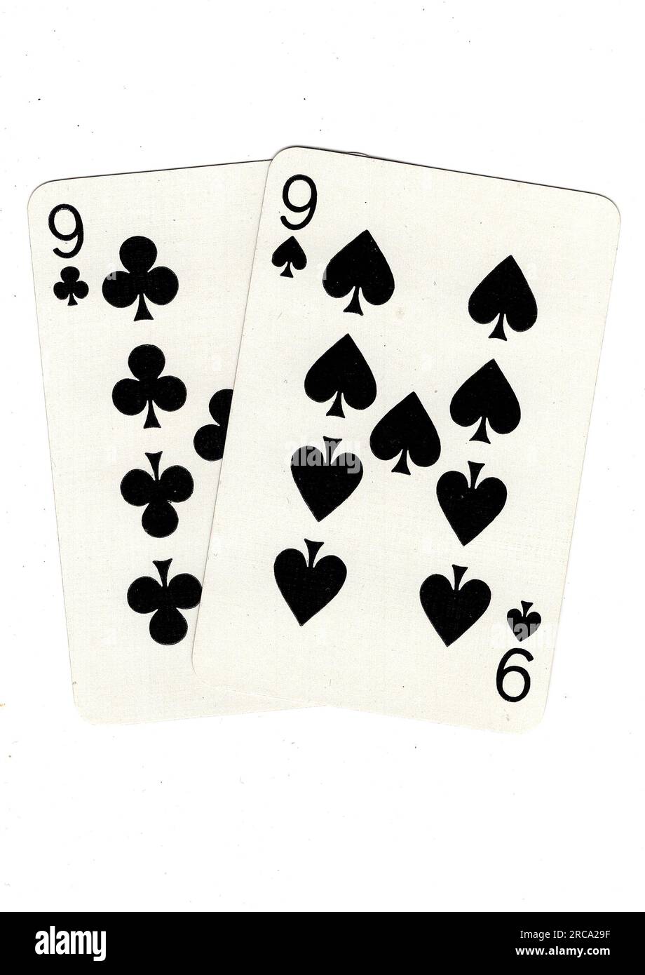 Vintage playing cards showing a pair of black nines on a white ...