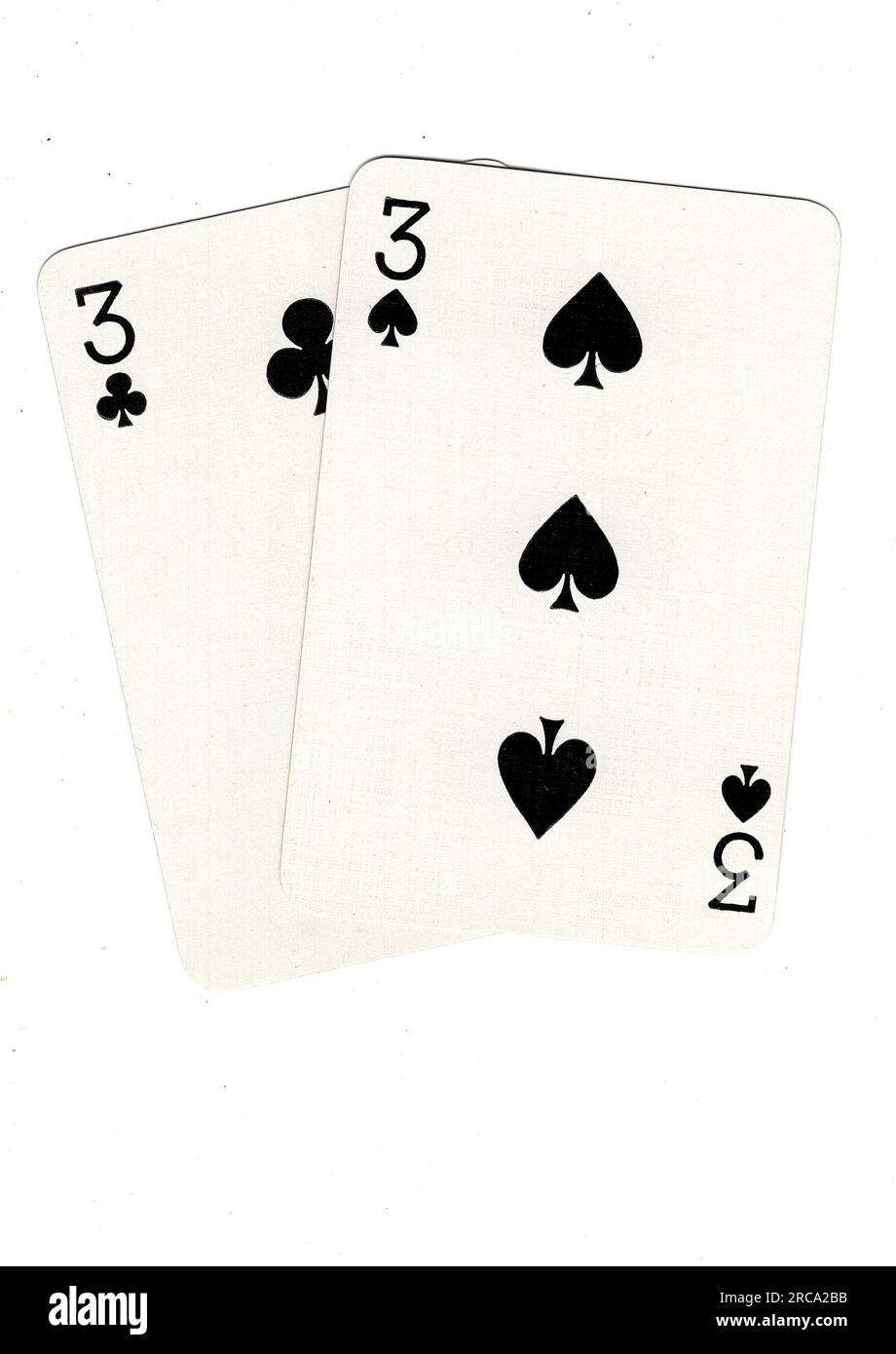 Vintage playing cards showing a pair of black threes on a white ...