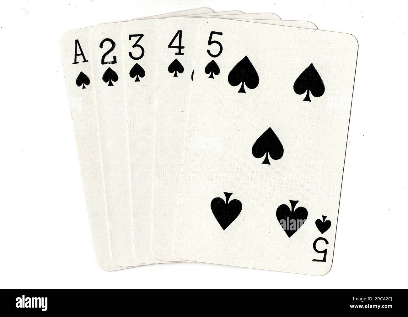 Vintage playing cards showing a flush of spades on a white background ...
