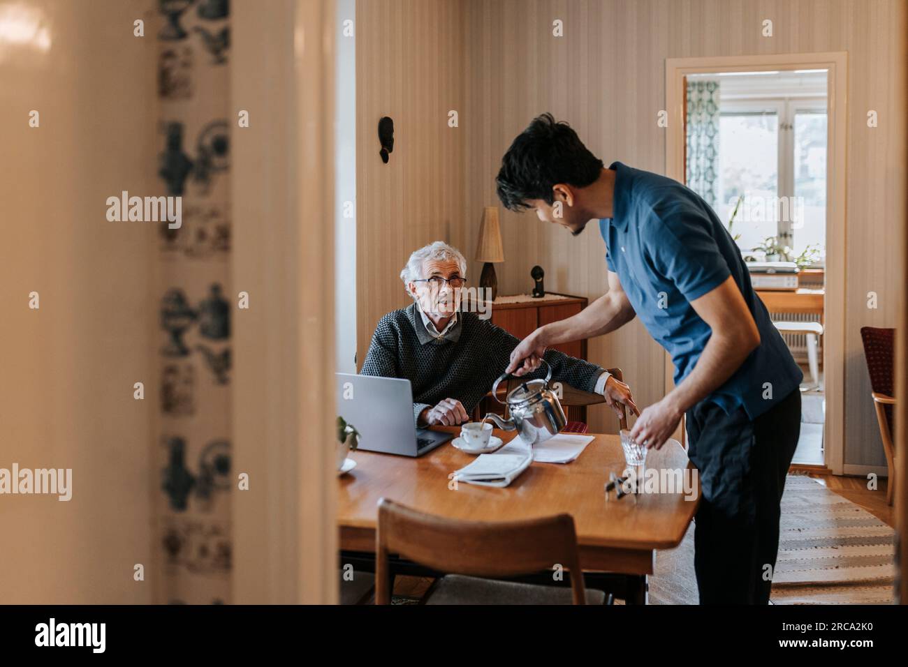 Senior man pouring tea hi-res stock photography and images - Alamy