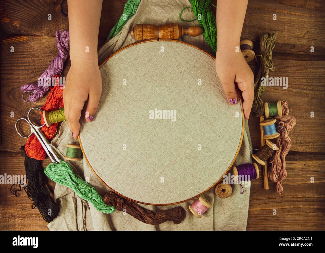 Embroidery needlework background Linen in hoop mockup. Colorful floss ...