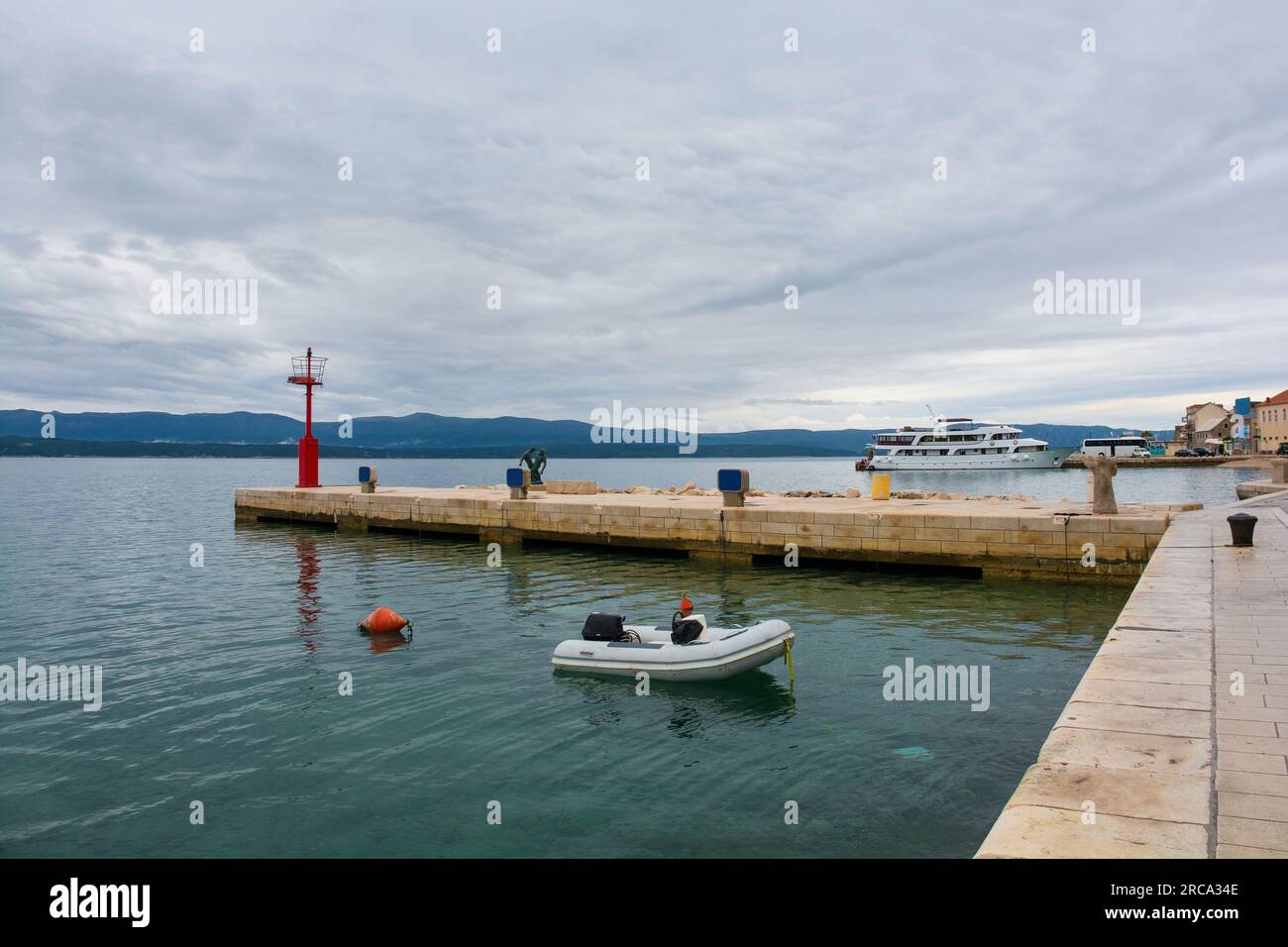 A pier and harbour beacon on the waterfront of Bol town on Brac Island ...