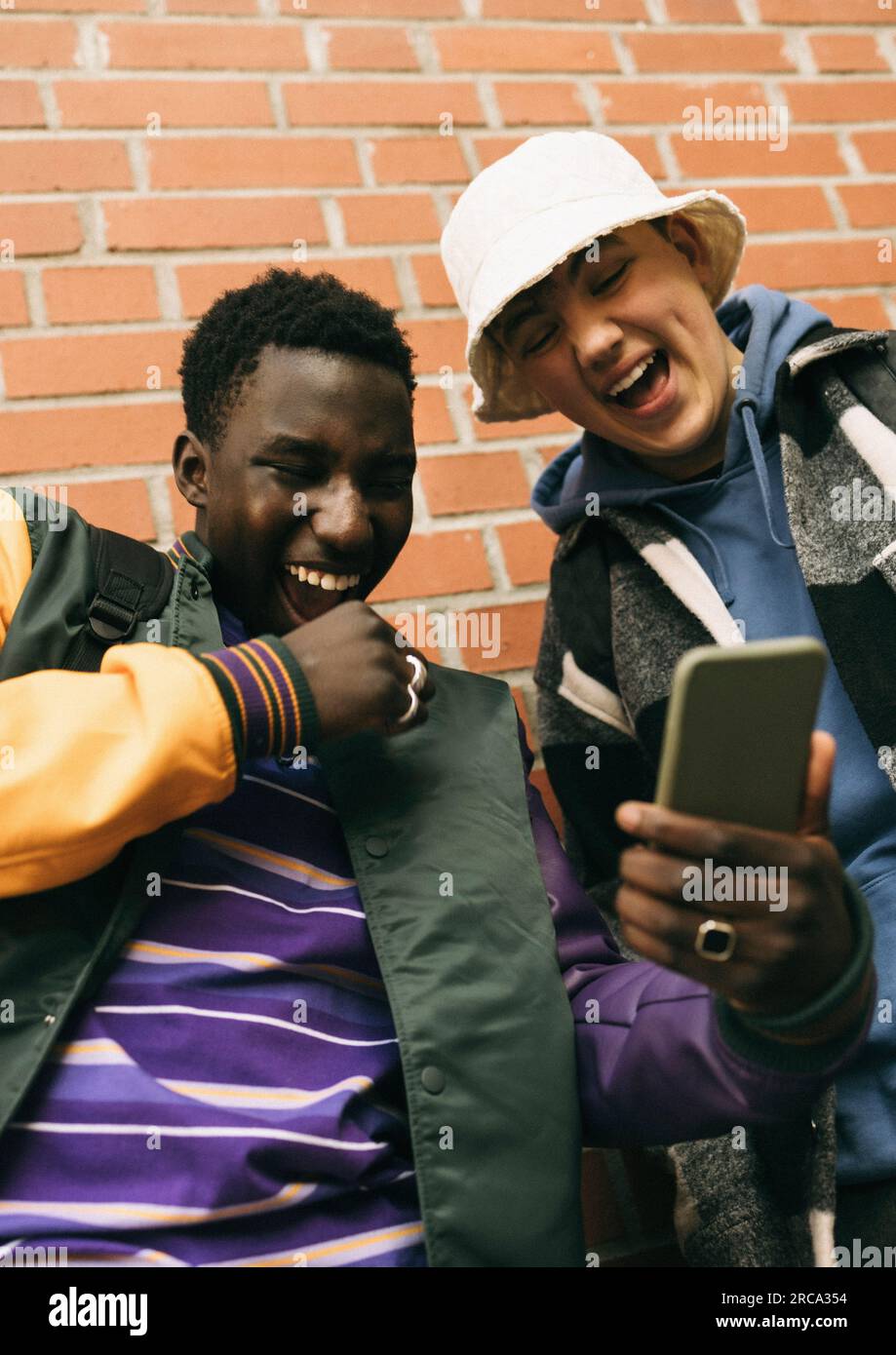 Two male teenagers laughing hi-res stock photography and images - Alamy