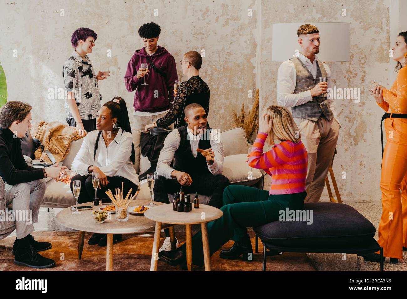 Multiracial business colleagues communicating with each other during ...