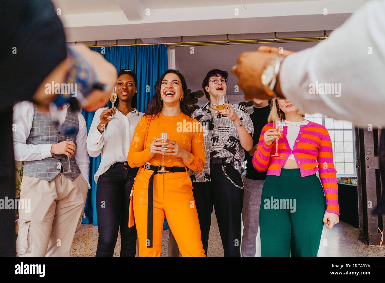 Happy business colleagues enjoying during event at convention center ...