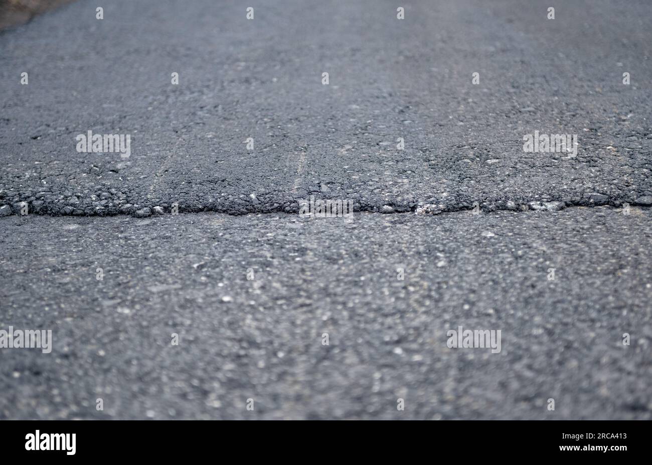road repair, asphalt laying on the road Stock Photo - Alamy