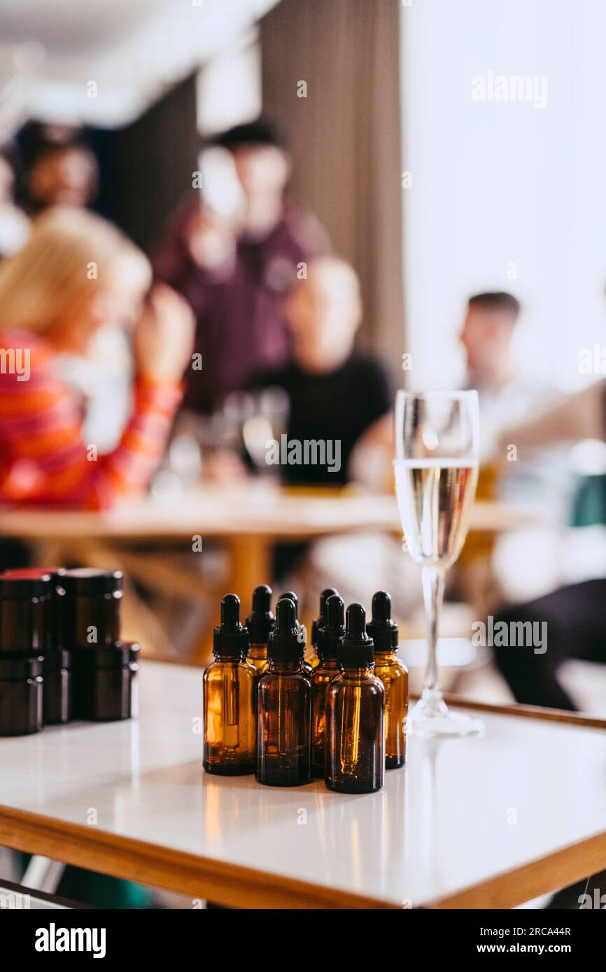 Merchandise bottles arranged on table during event at convention center ...