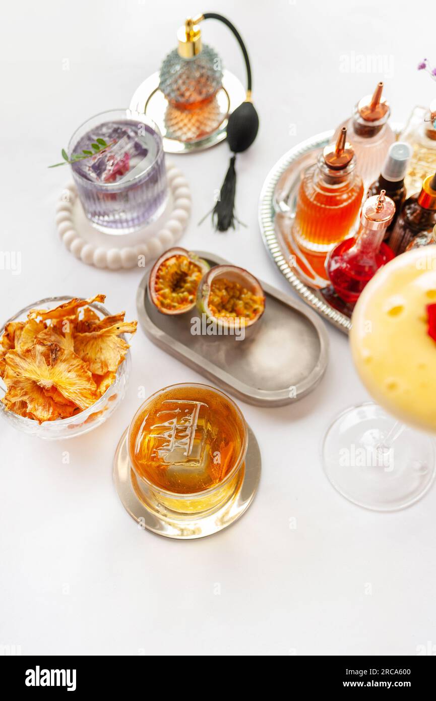 Five colorful summer cocktails in glasses on white table. Assortment of ...