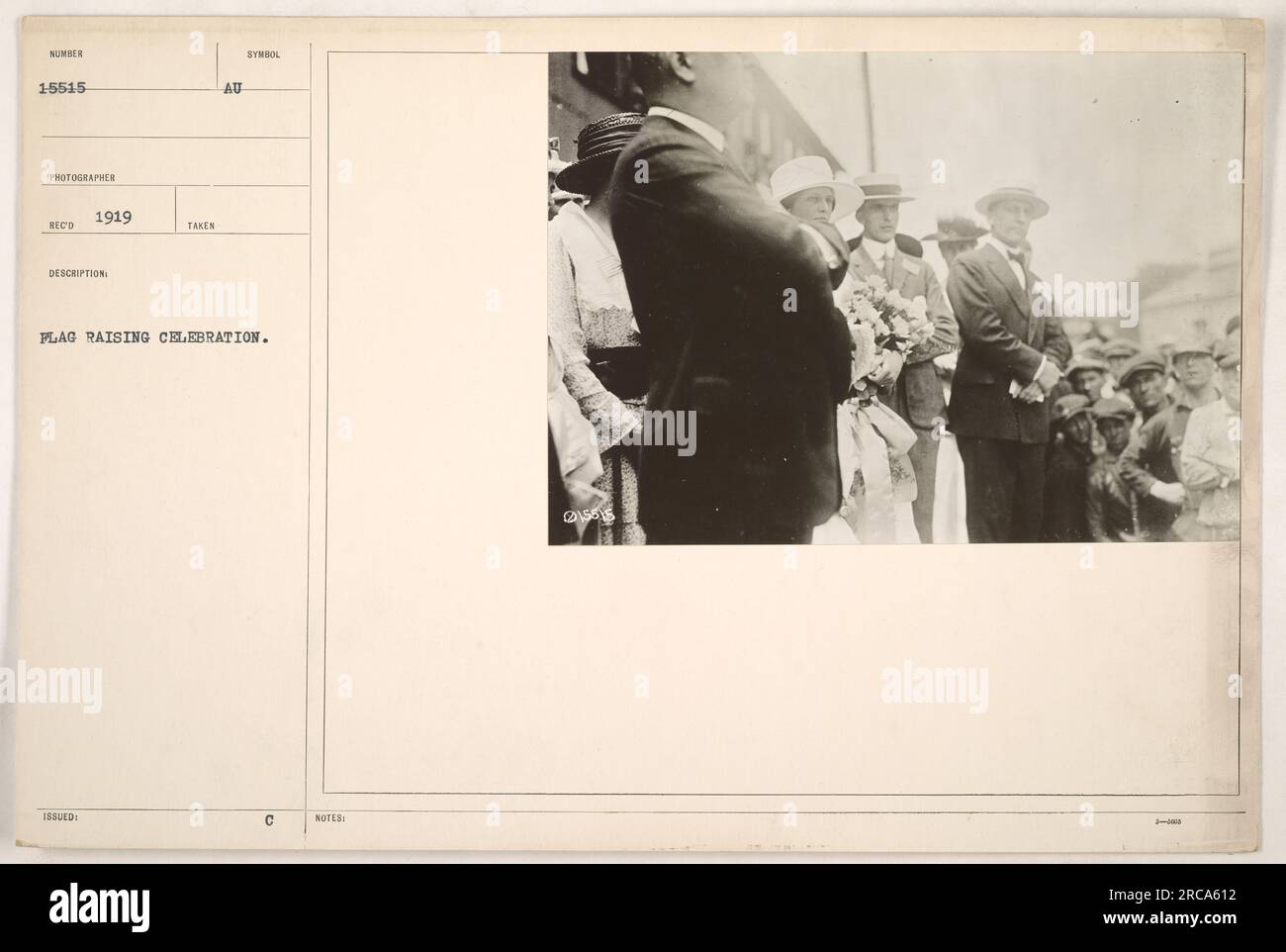 Soldiers raise the American flag during a celebration in 1919. The ...