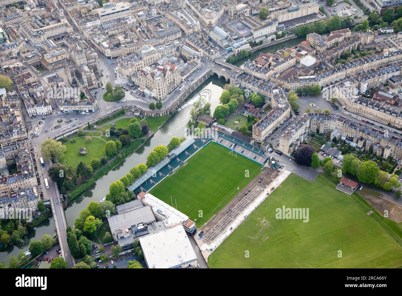 Aerial photograph of Bath Rugby ground and Pulteney Bridge and weir ...