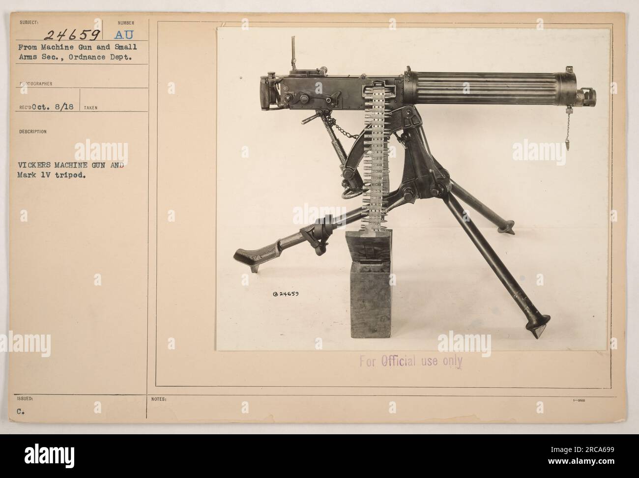 Image depicts a Vickers machine gun mounted on a Mark IV tripod. The ...