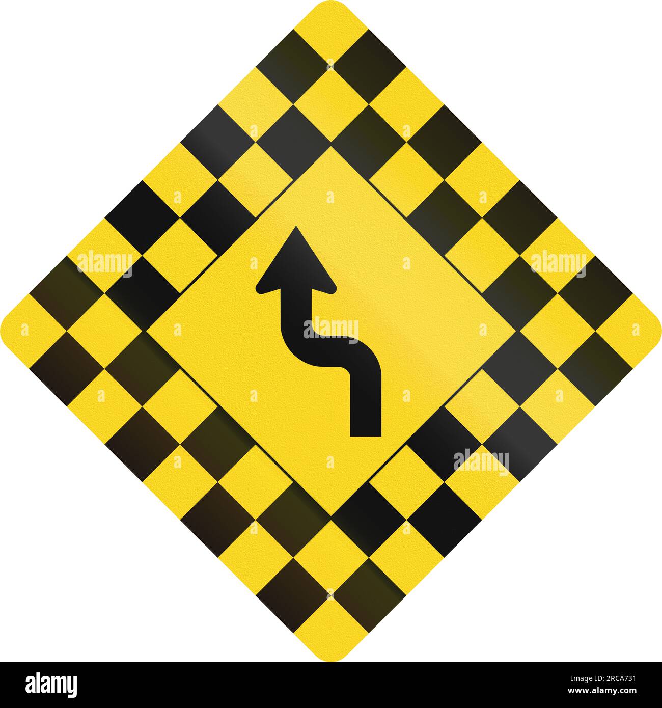 Checked warning road sign in Canada with reverse curve. This sign is ...