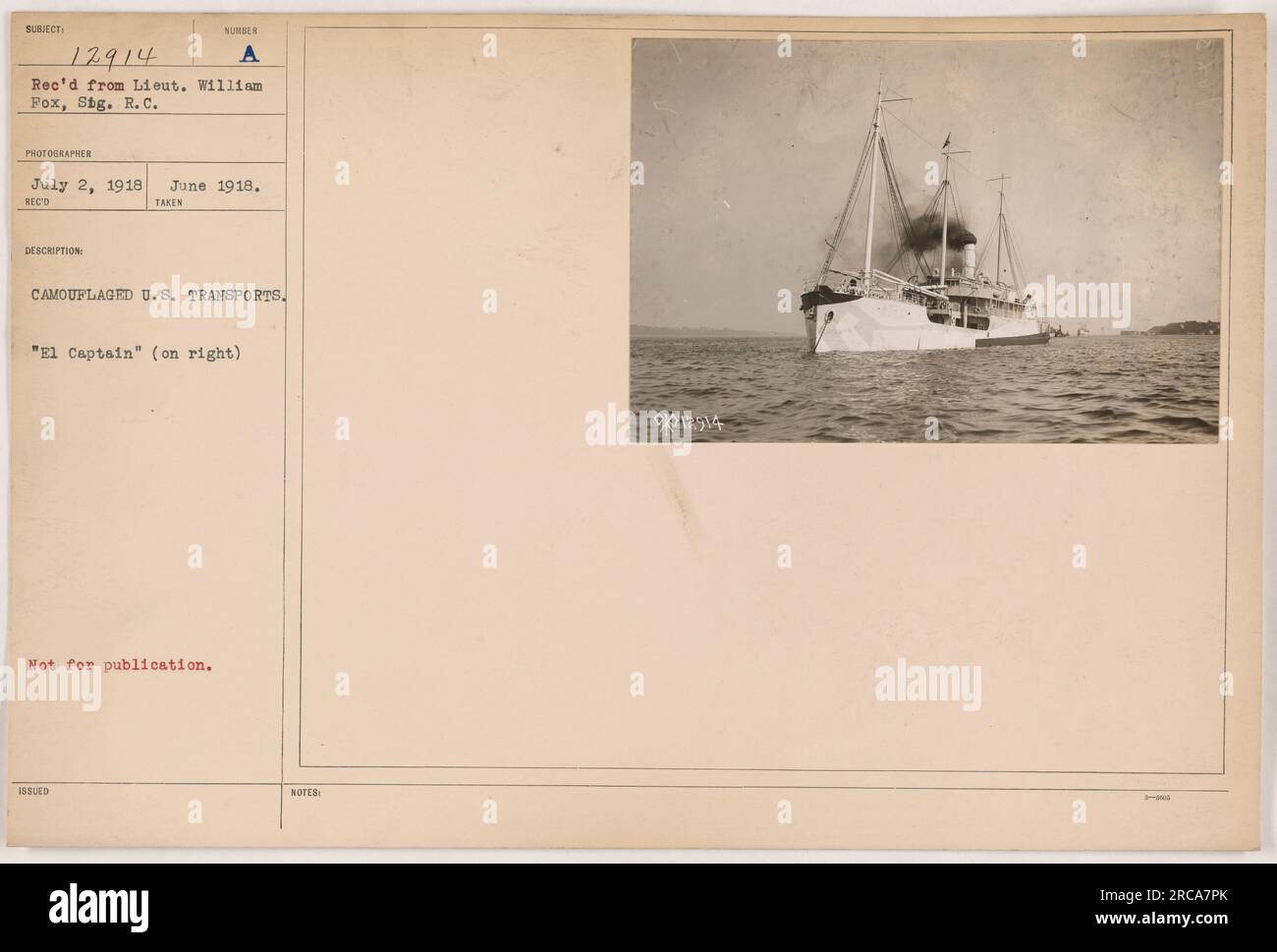 A camouflaged U.S. transport, known as "El Captain" seen on the right ...