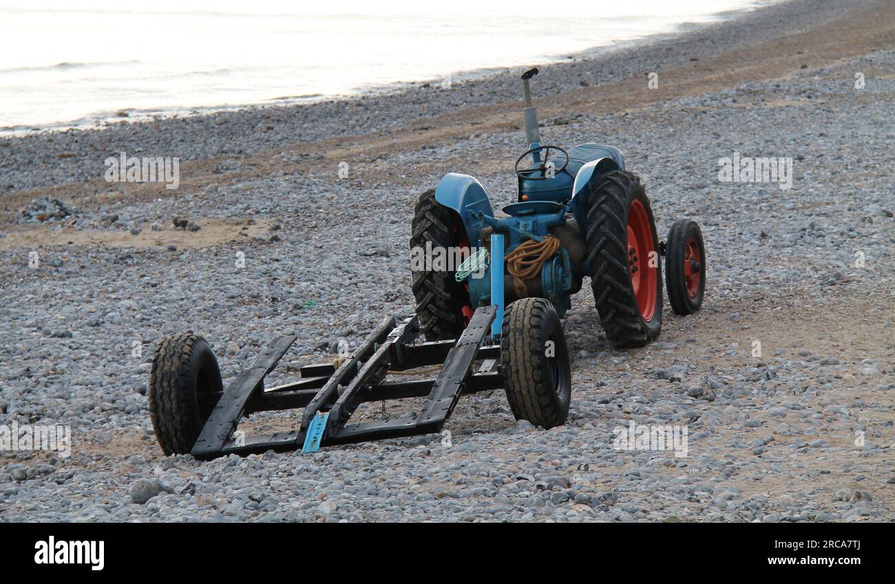 A Tractor on the Beach for Transporting Fishing Boats Stock Photo - Alamy